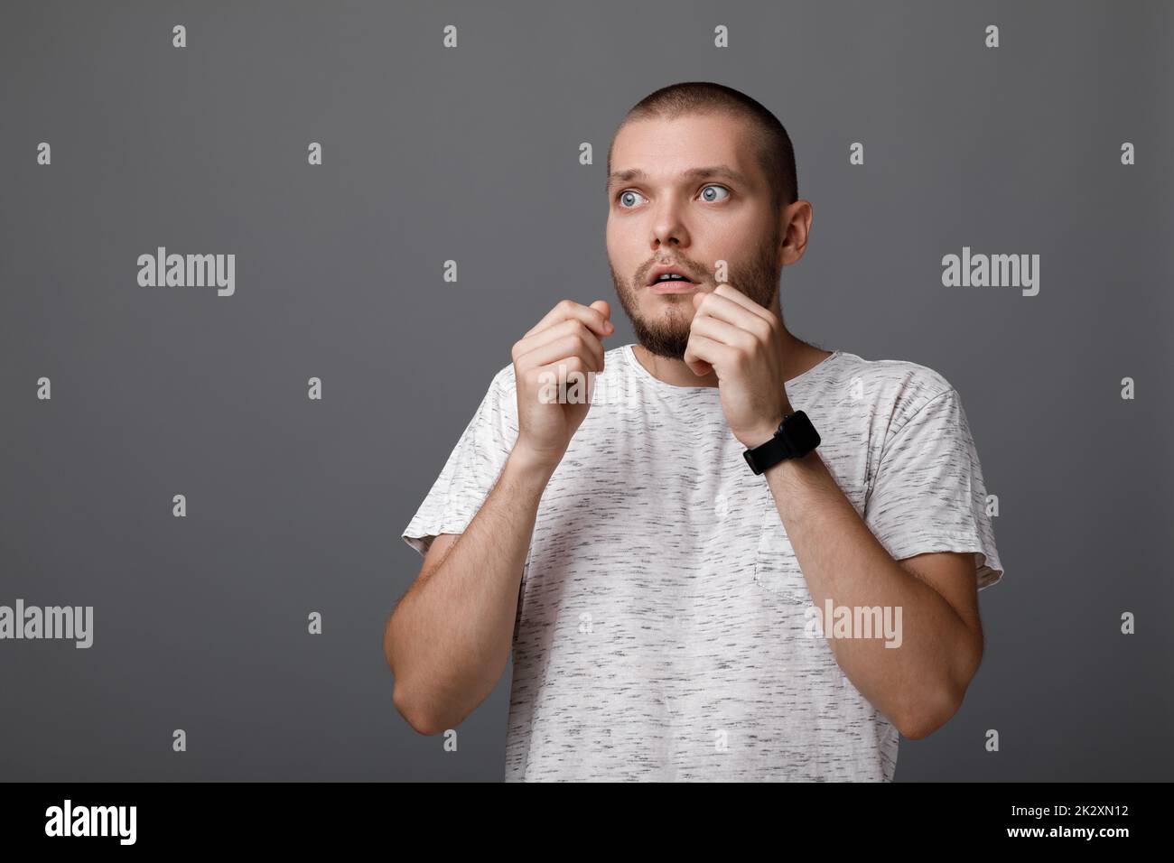 Scared young bearded man hi-res stock photography and images - Alamy