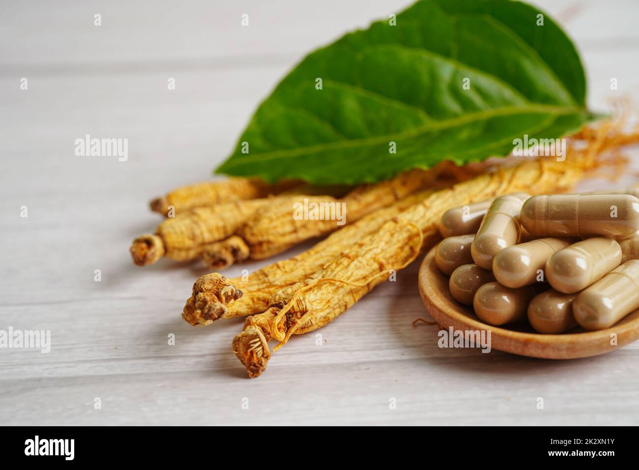 Ginseng roots and green leaf, healthy food Stock Photo - Alamy