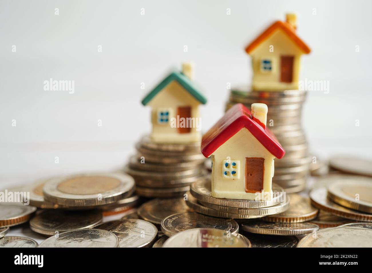 House on stack of coins, Investment property finance concept Stock ...