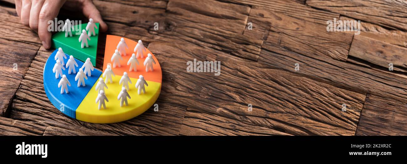 Placing A Last Piece With Human Figures Into Pie Chart Stock Photo - Alamy