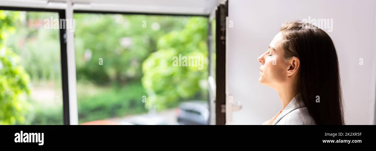Woman Looking Through Window Stock Photo - Alamy