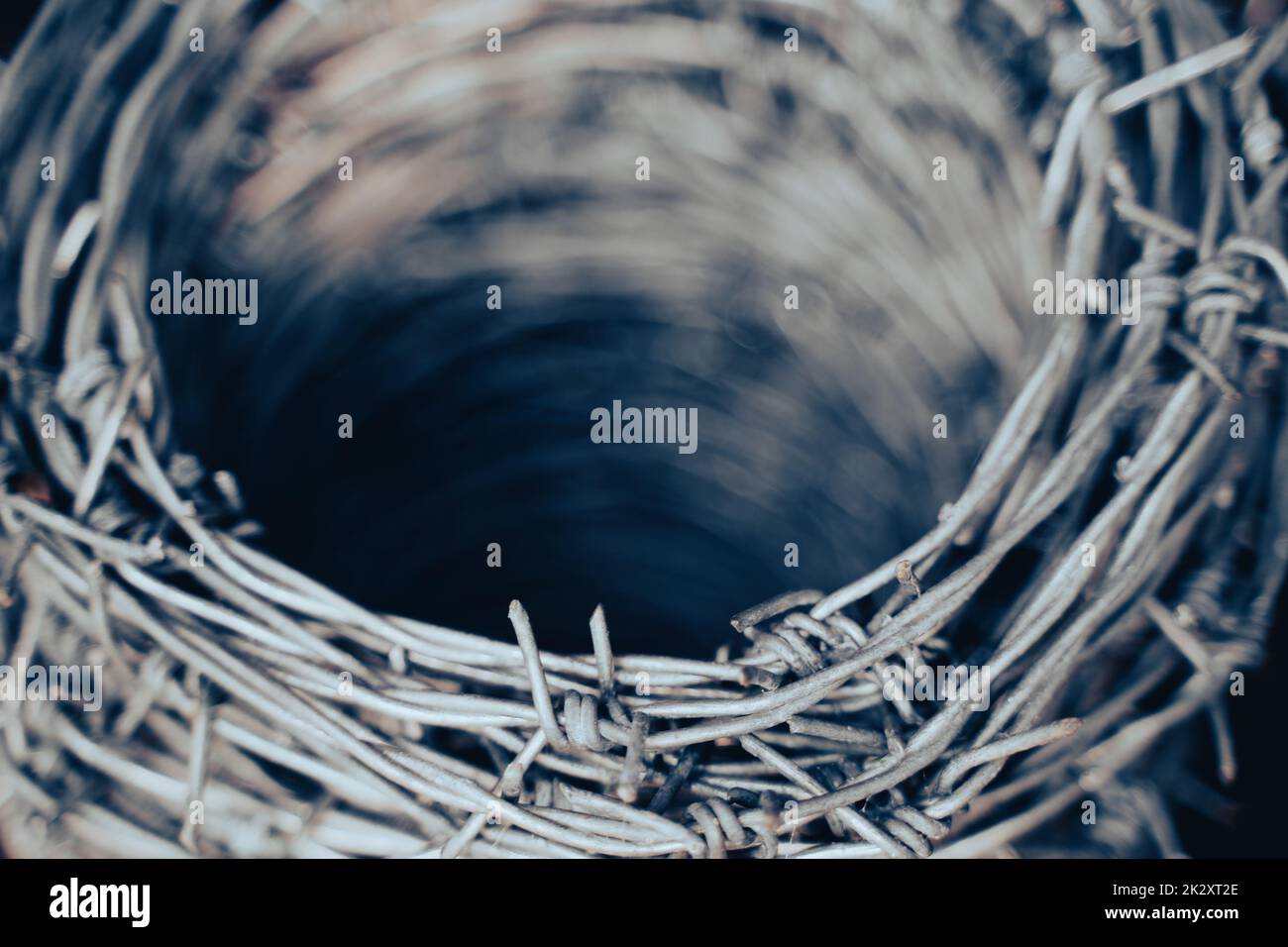 macro detail of roll of steel barbed wire Stock Photo - Alamy