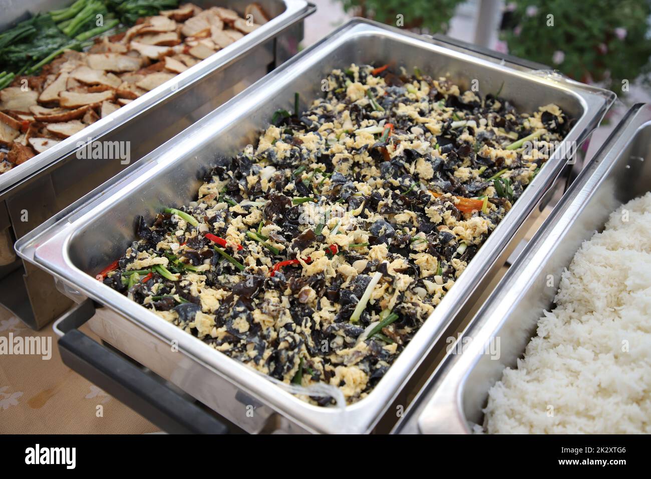 Sauteed Ear Mushroom with Egg in buffet line. The container is a ...