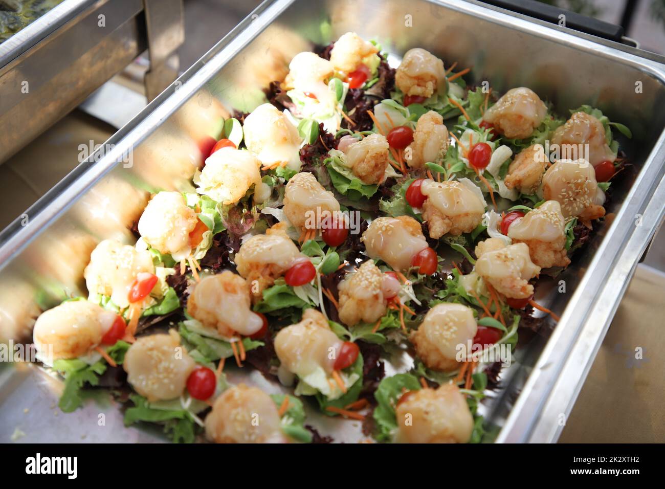 Fried shrimp salad with cream that is arranged in bite size in buffet ...