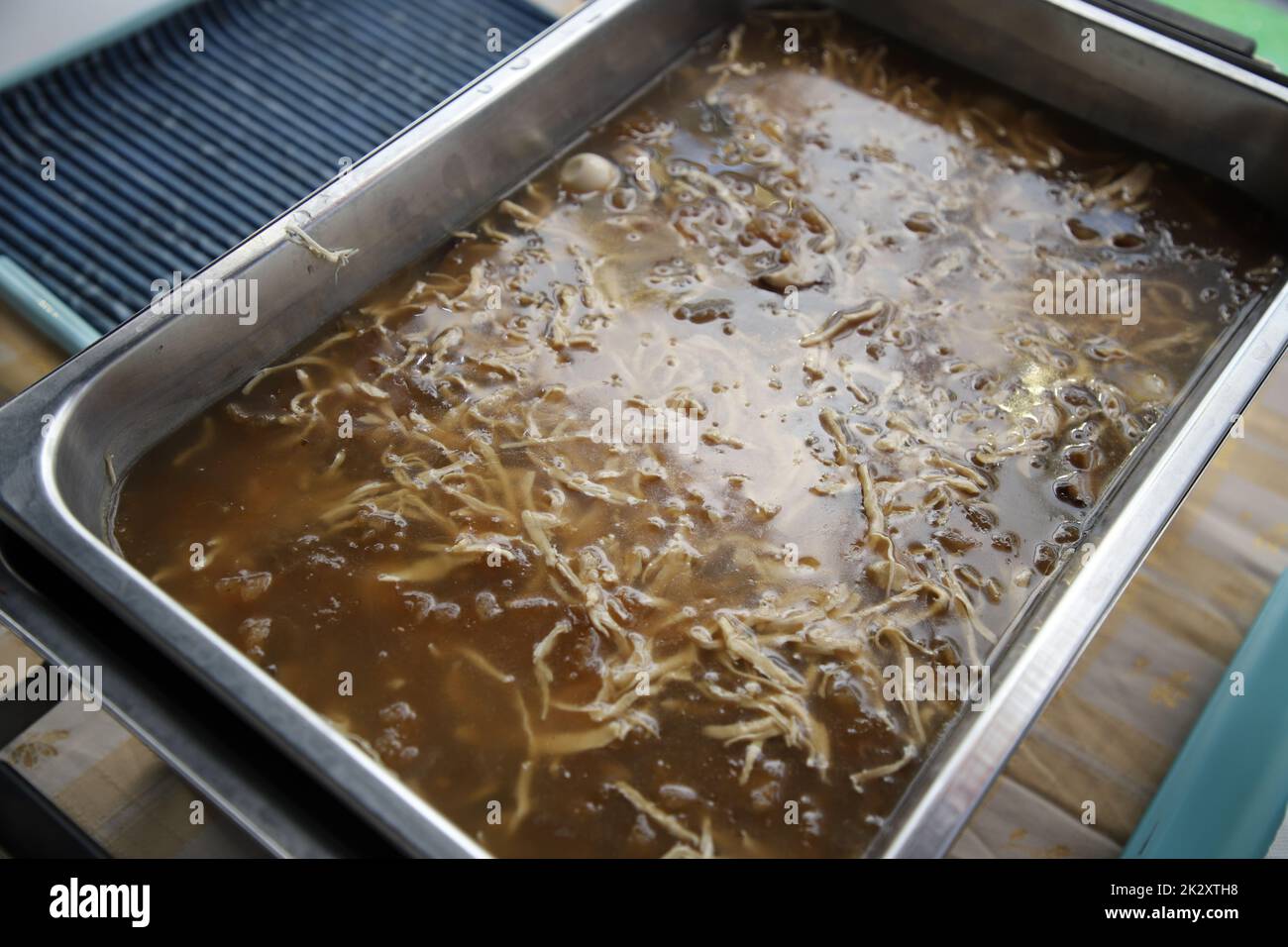 Fish Maw and Chicken Soup in buffet line. The container is a ...