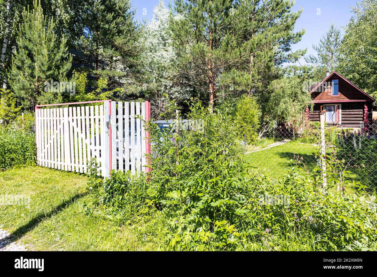 wooden gates and green yard in holiday village Stock Photo - Alamy