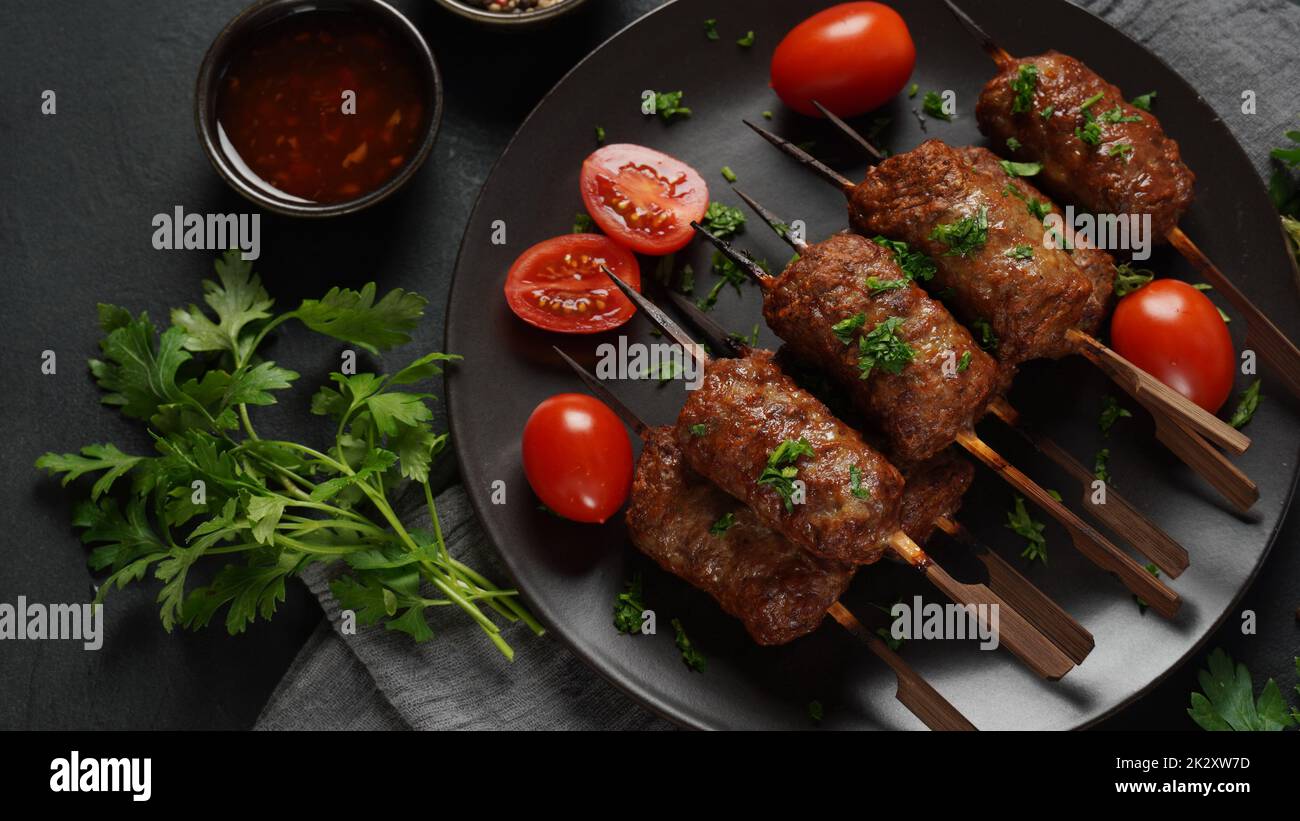 Shish kebab is a popular meal of skewered and grilled cubes of meat ...