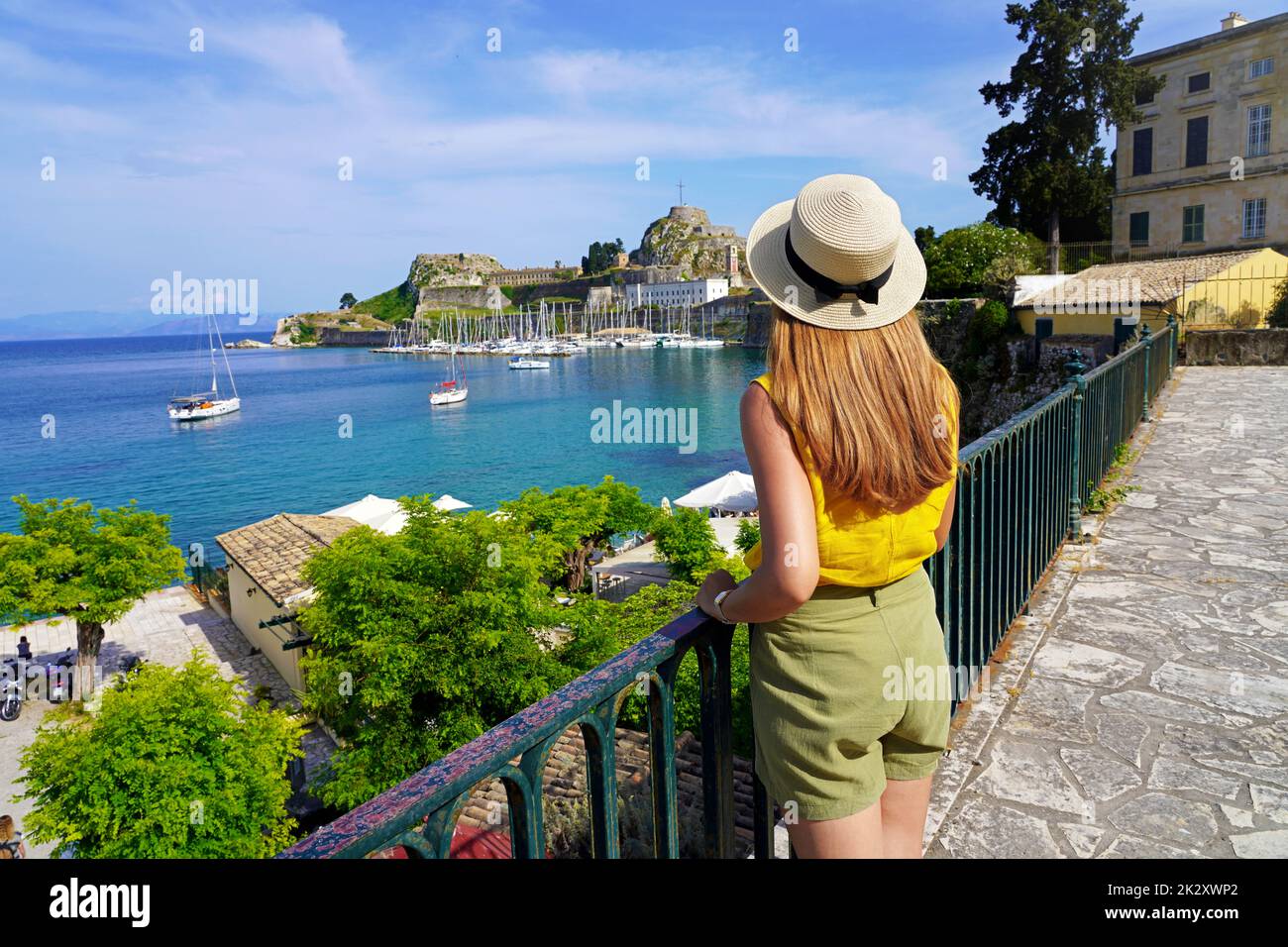 Holidays in Greece. Back view of beautiful traveler girl enjoying view ...