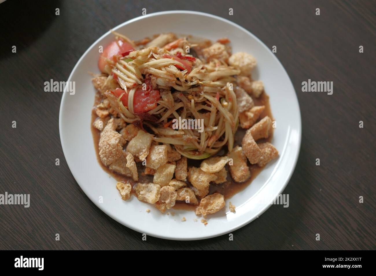 Delicious Som Tam -Thai green papaya salad with green beans, tomatoes ...