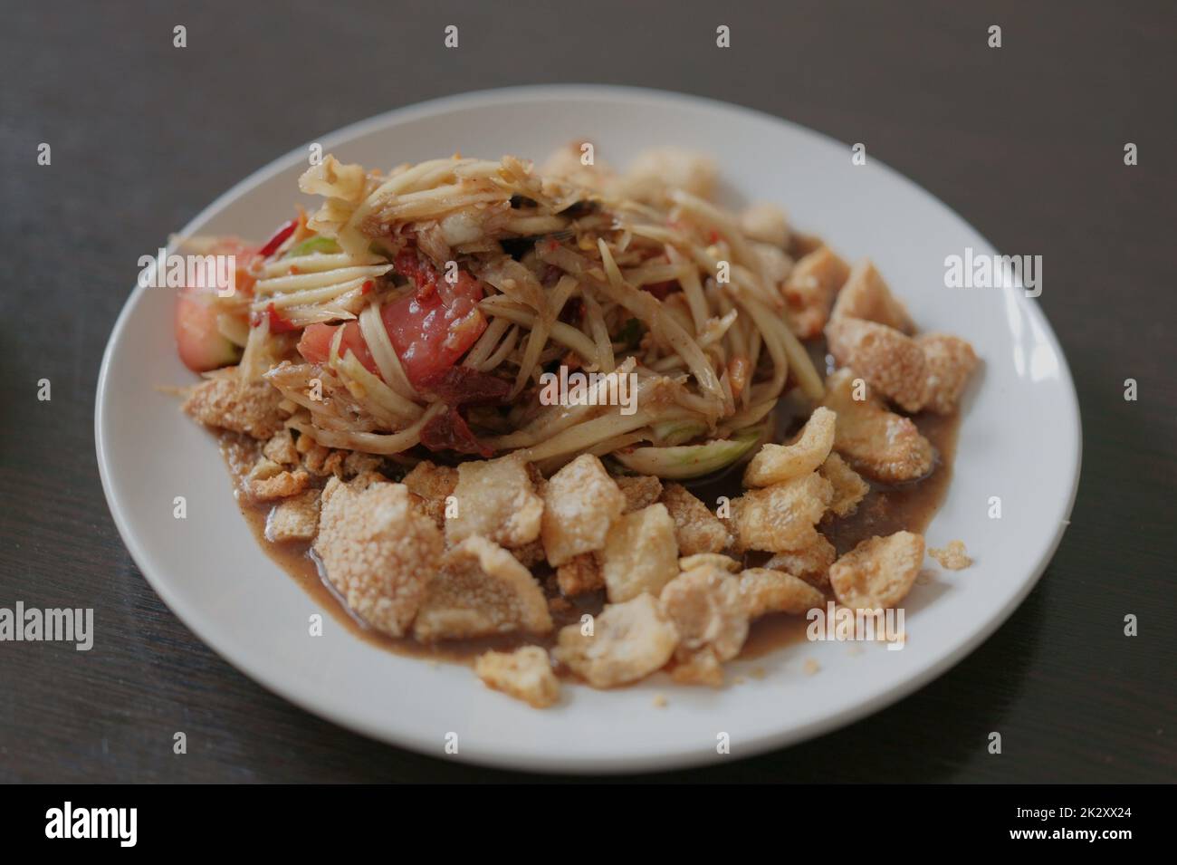 Delicious Som Tam -Thai green papaya salad with green beans, tomatoes ...