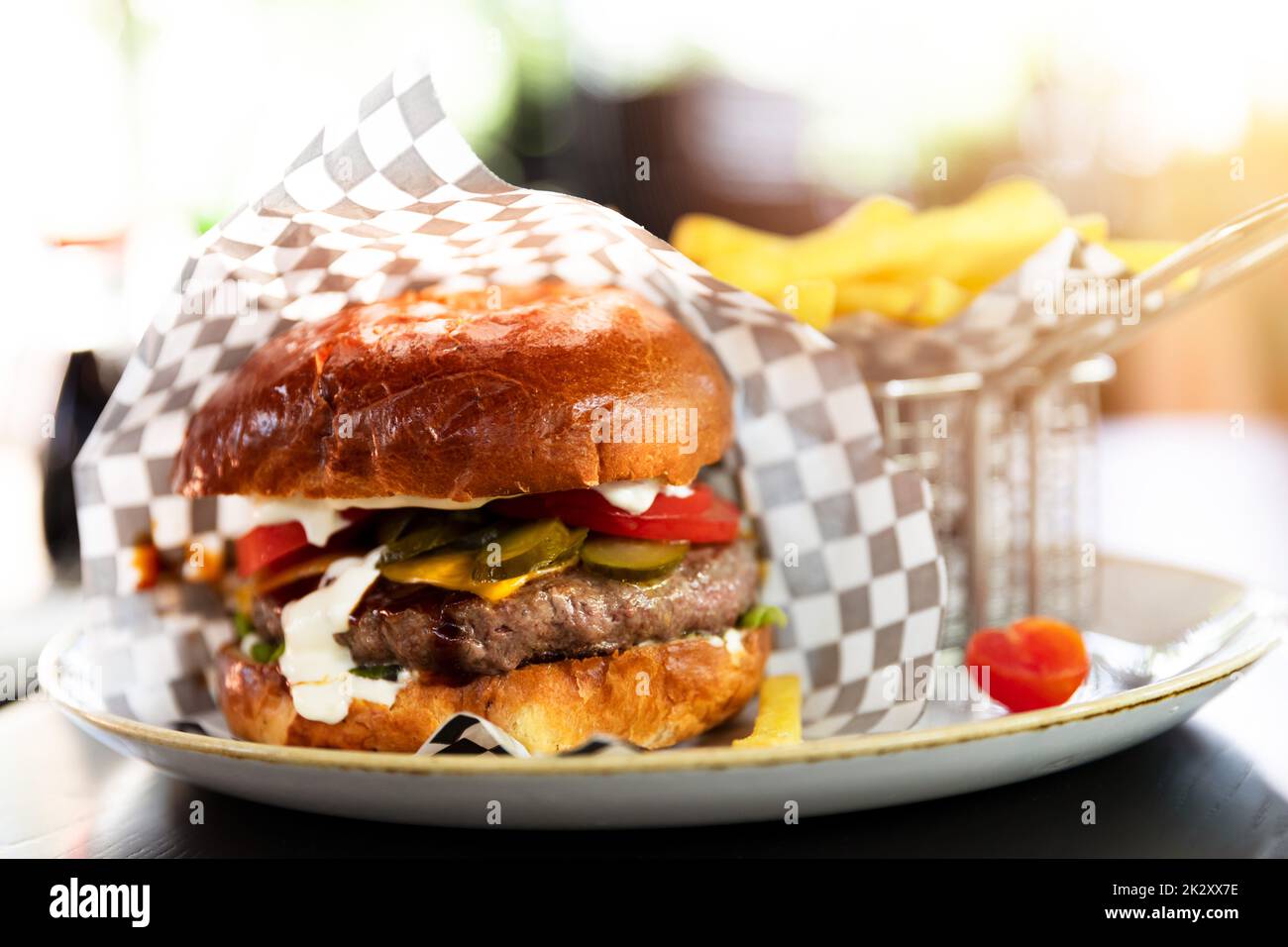 Hamburger in a takeaway container on the wooden background. Food ...
