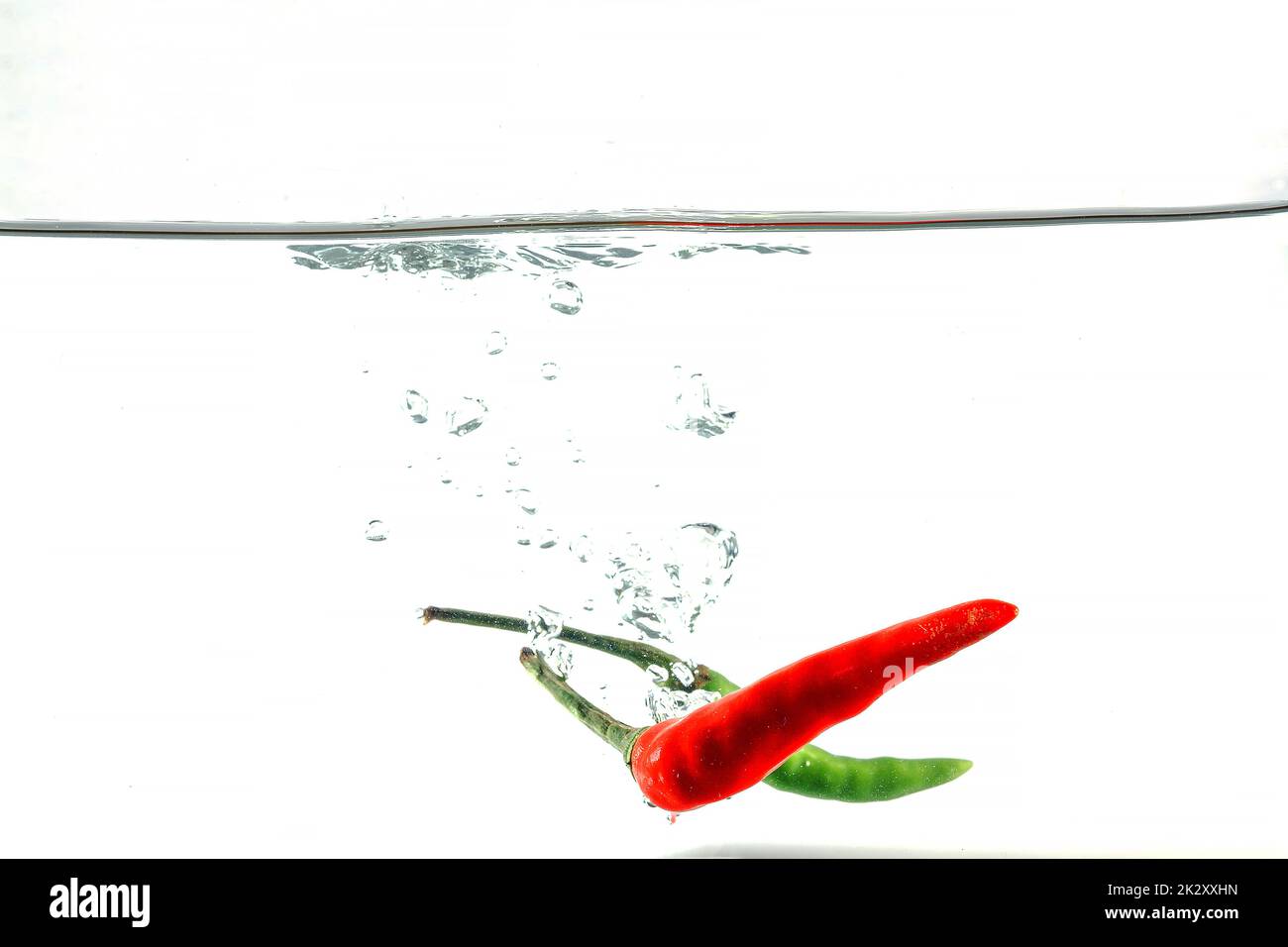 Red chilli, water splashes, solated on a white background Stock Photo ...