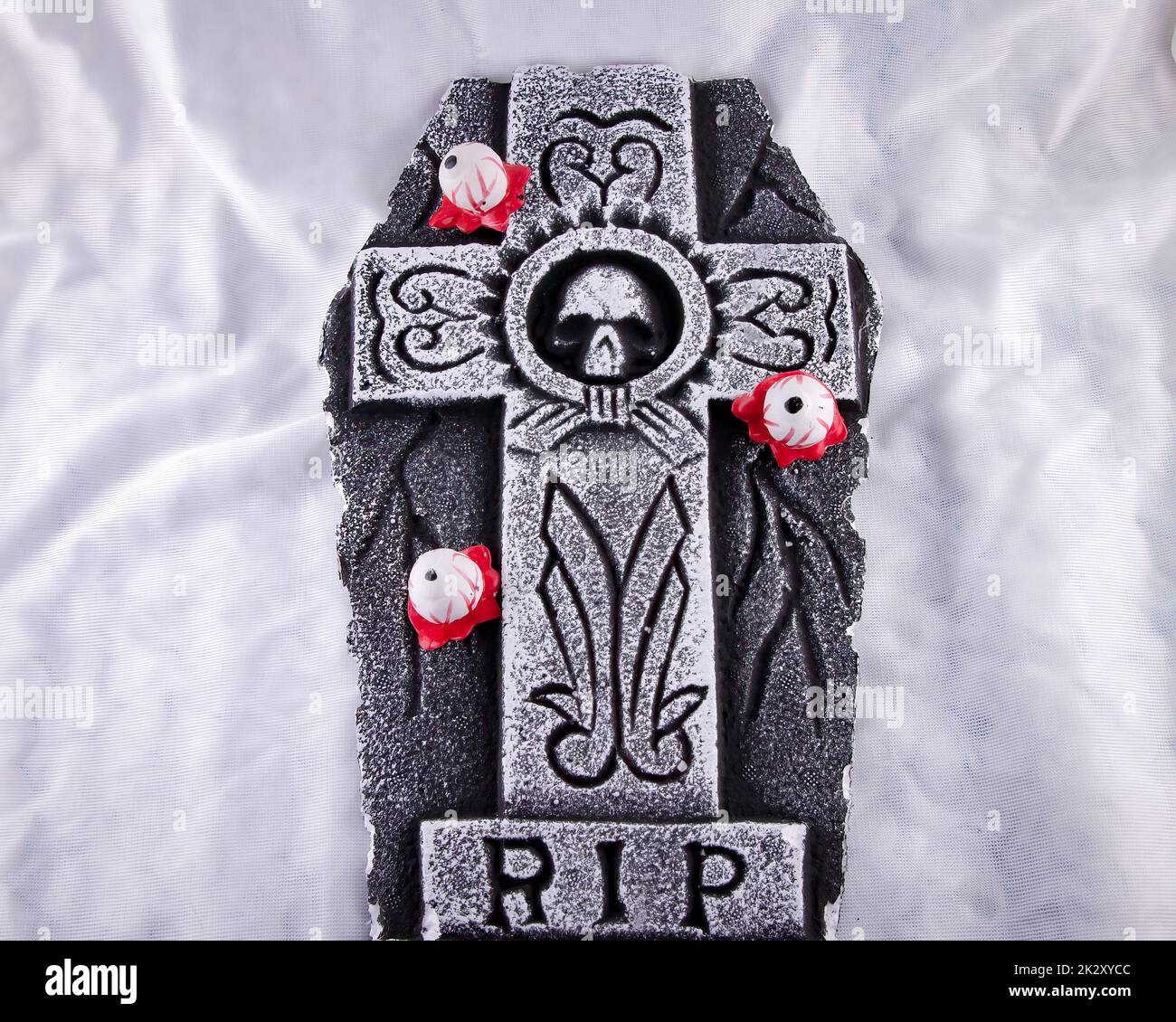 A spooky Halloween RIP gravestone with a cross Stock Photo - Alamy