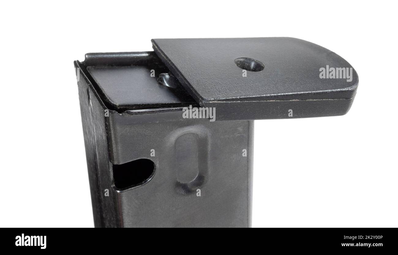 Bottom plate on a handgun magazine sliding off on a white background ...