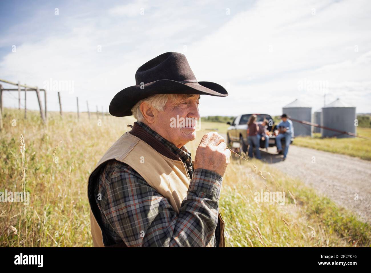 Man standing alone in grass hi-res stock photography and images - Alamy