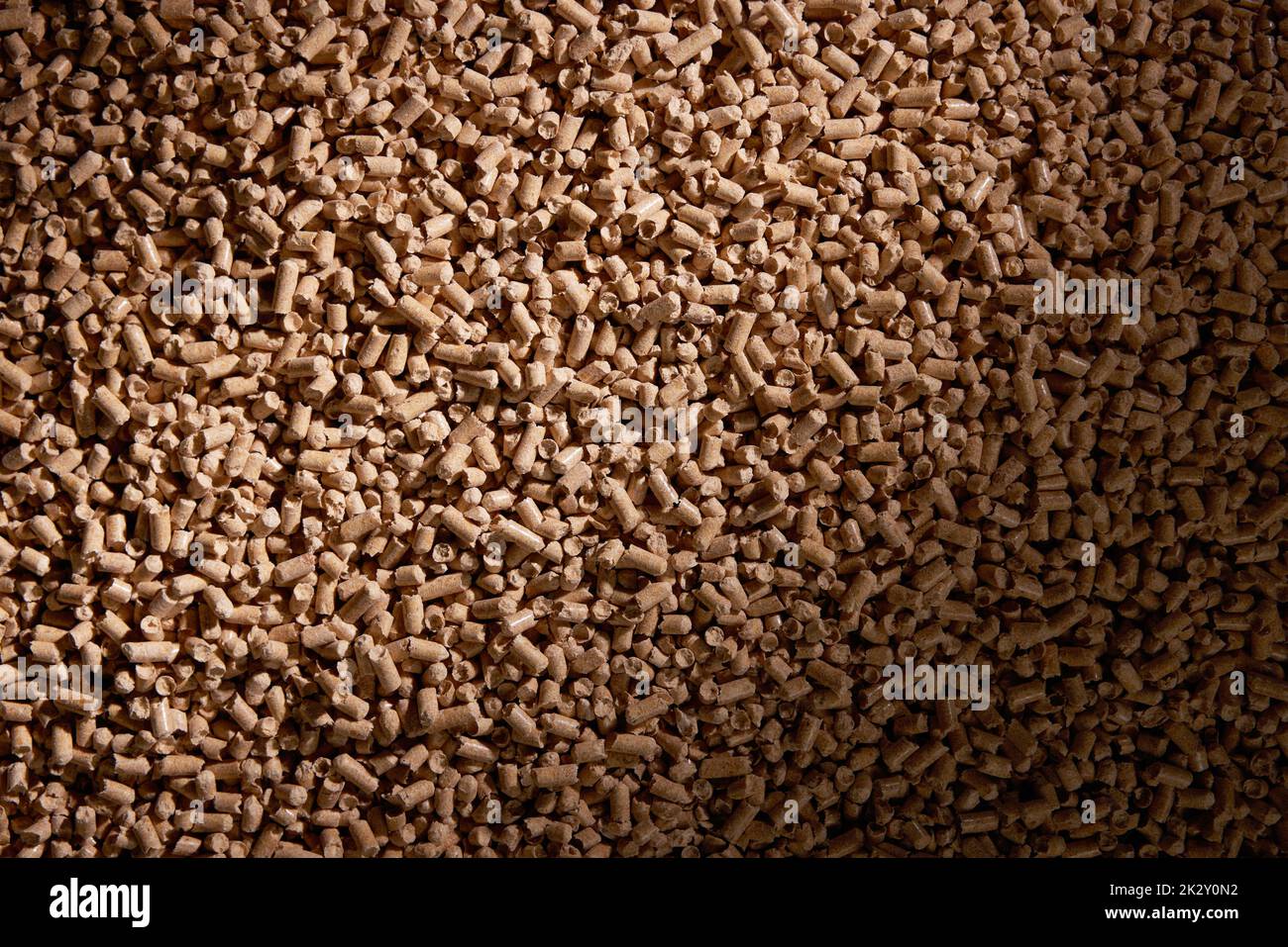 Natural background of heap of wooden pellets Stock Photo - Alamy