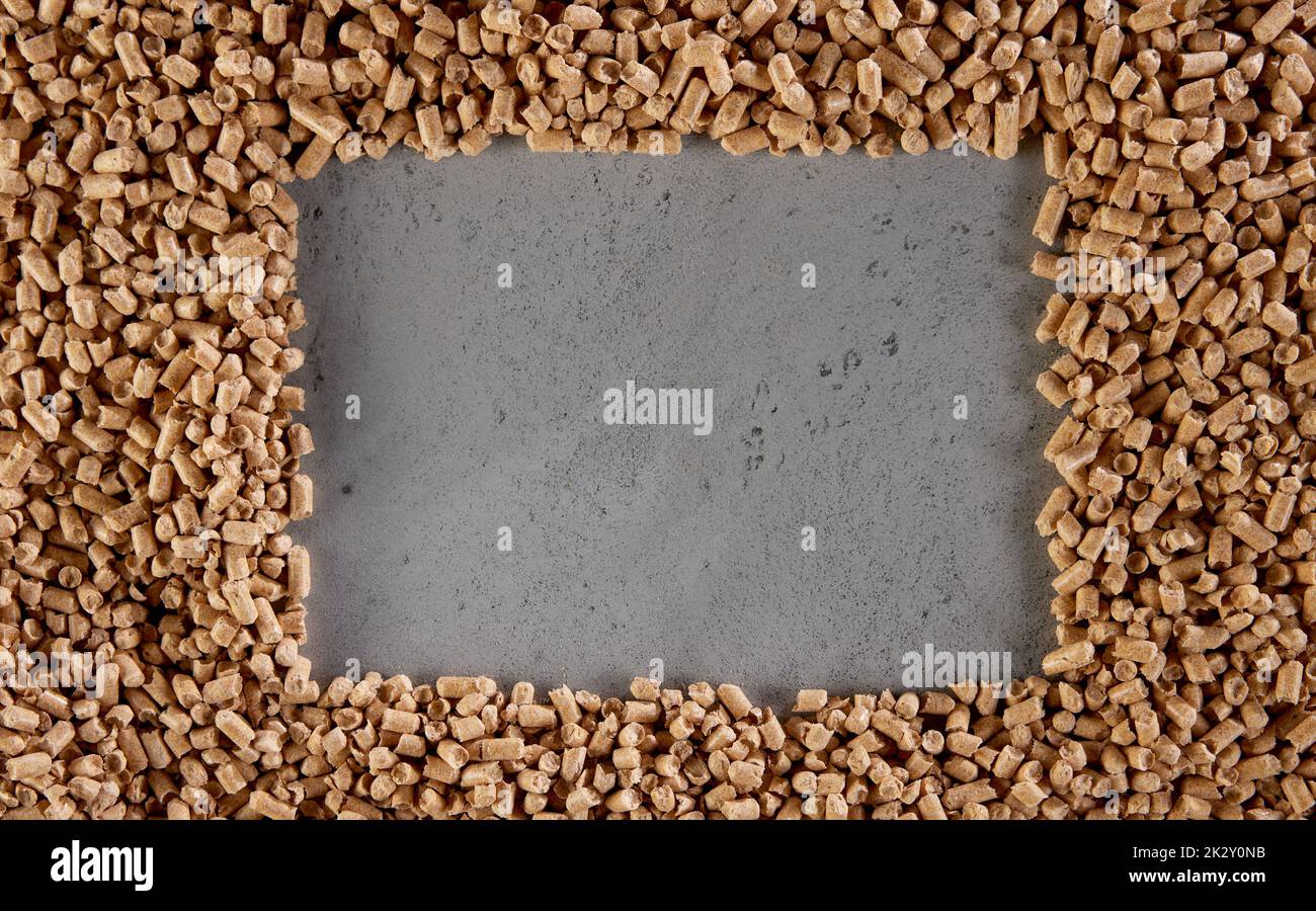 Natural frame made of fuel pellets on gray surface Stock Photo - Alamy