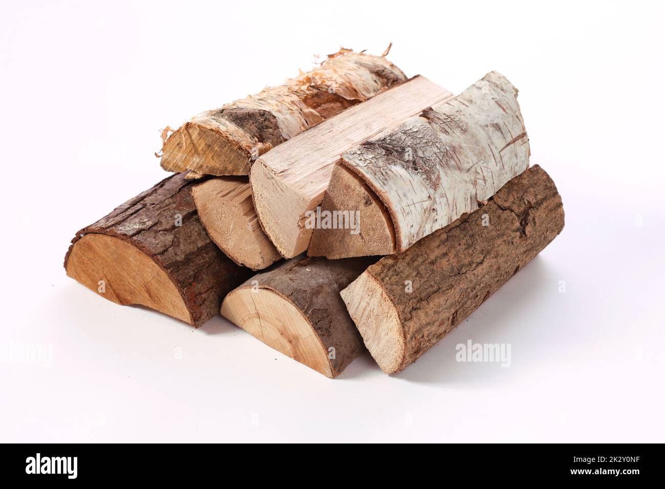 Pile of firewood of different types in white studio Stock Photo - Alamy