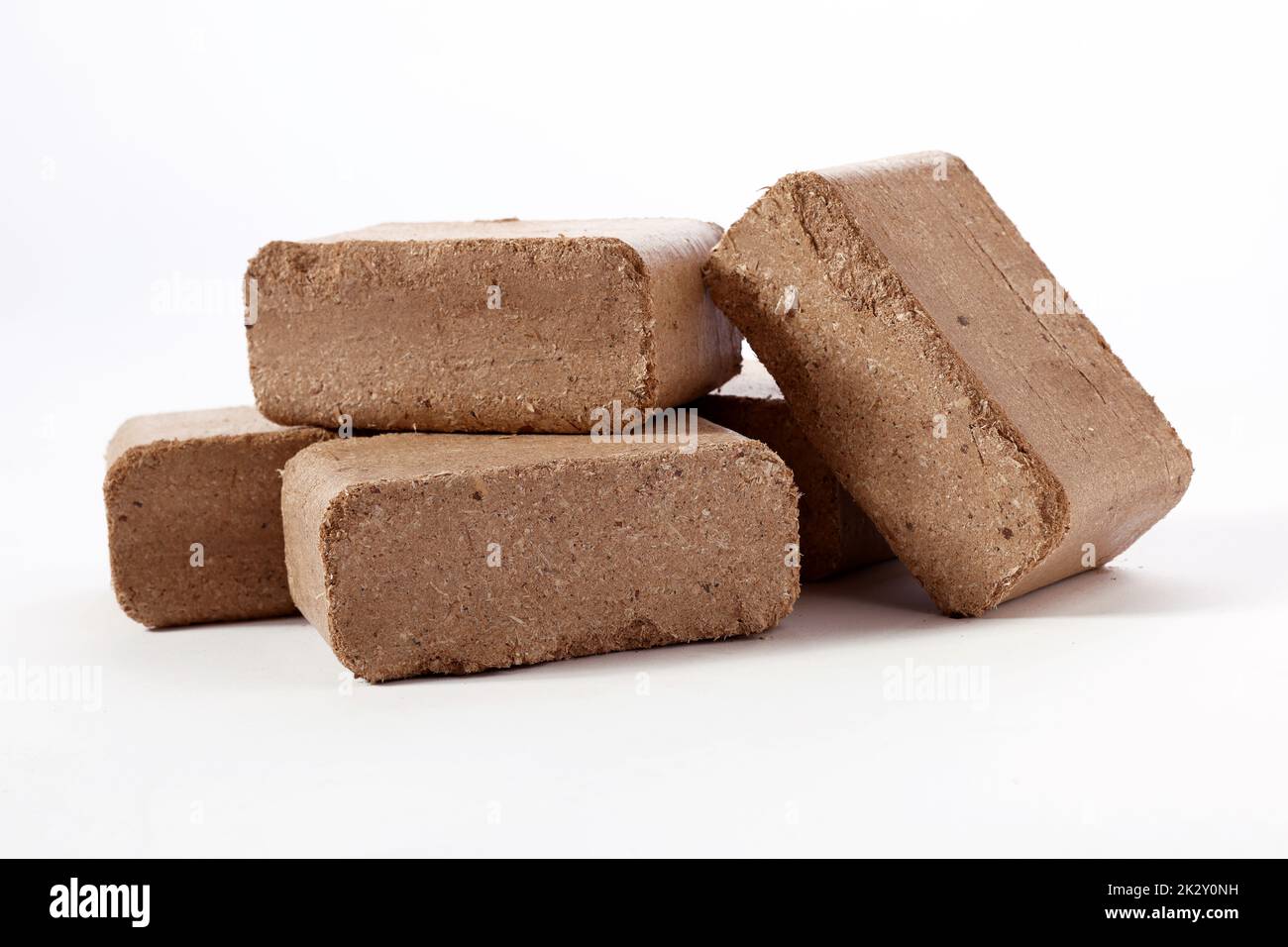 Rectangle shaped biomass briquettes on white surface Stock Photo - Alamy