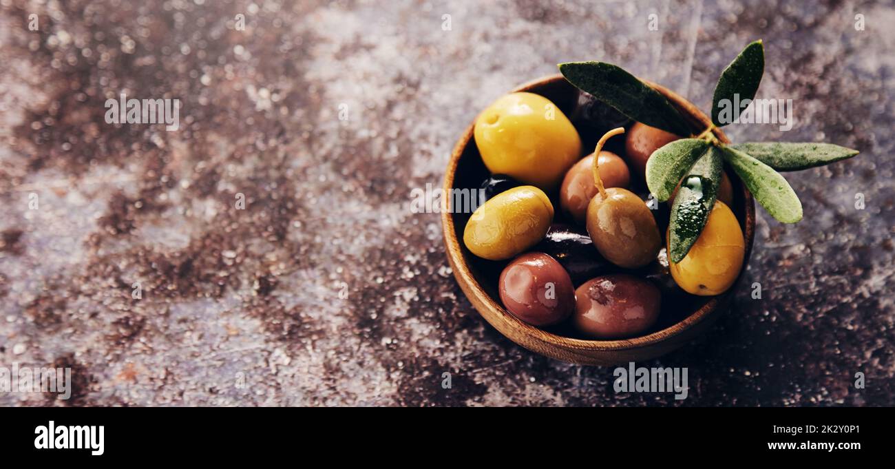 Pickled tasty olives on table Stock Photo - Alamy