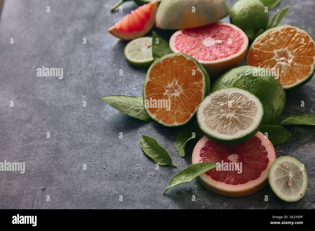 Assorted citrus fruits on table Stock Photo - Alamy