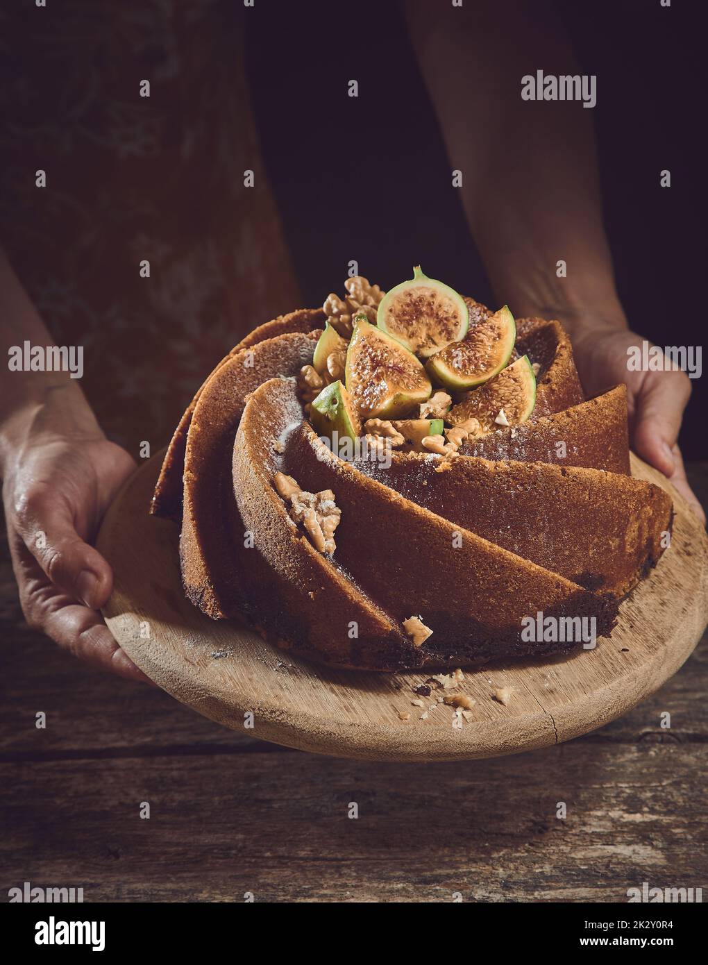 Anonymous chef with homemade fig cake Stock Photo - Alamy