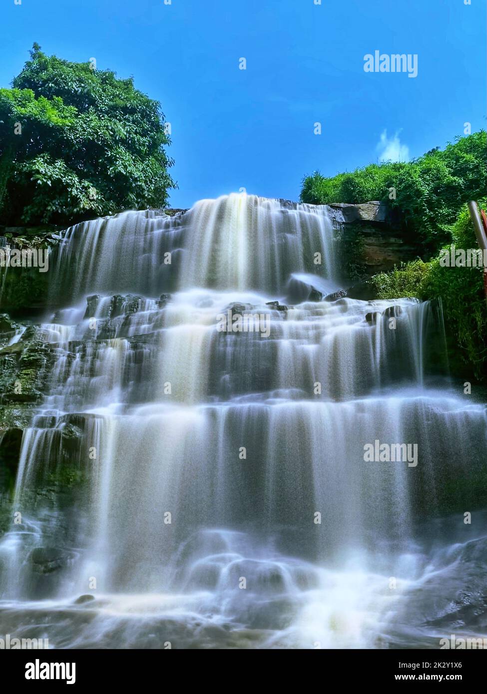 A vertical shot of the beautiful Kintampo Waterfalls in Ghana under the ...