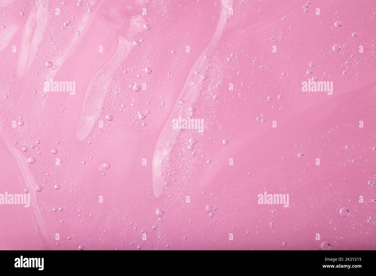 Macro photography of bubbly smear on raspberry pink background Stock ...