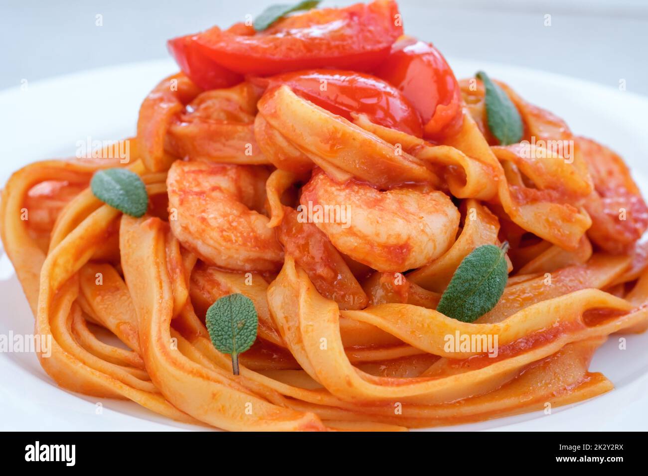 Tomato garlic shrimp tagliatelle pasta Stock Photo - Alamy