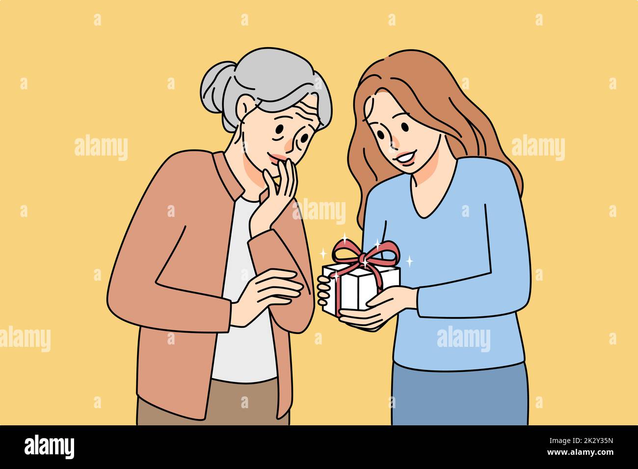 Caring young woman greeting elderly grandmother Stock Photo - Alamy