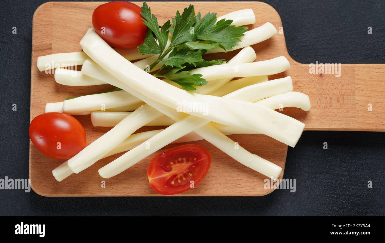 String cheese or cheese whip - salty snack cheese with cherry tomatoes ...