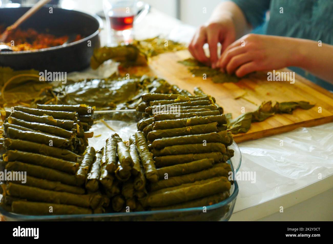 a cook making stuffed leaves, making stuffed leaves at home, stuffed ...