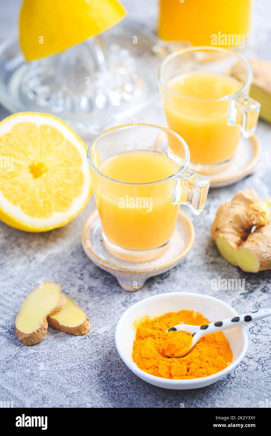 Close up of healthy Ginger Lemon Turmeric Shot Â– ideal to boost the ...