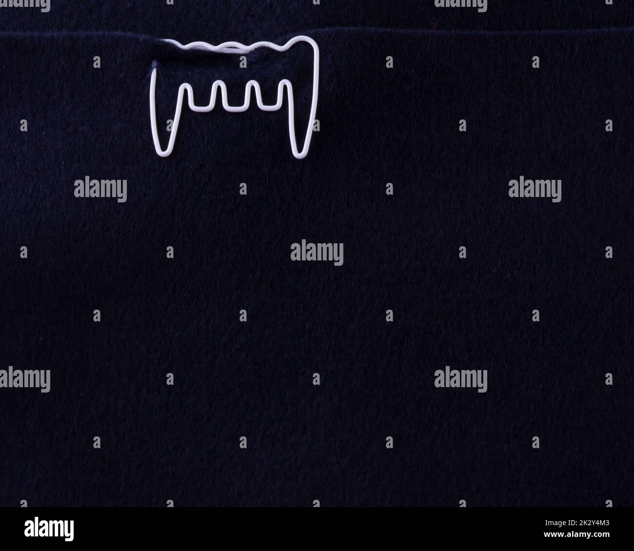 The white wire vampire fangs isolated on black background Stock Photo ...