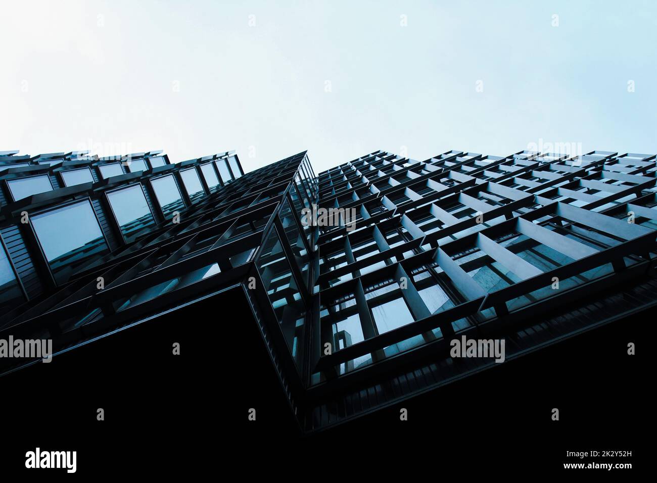A low angle of modern residential building against a blue sky Stock ...