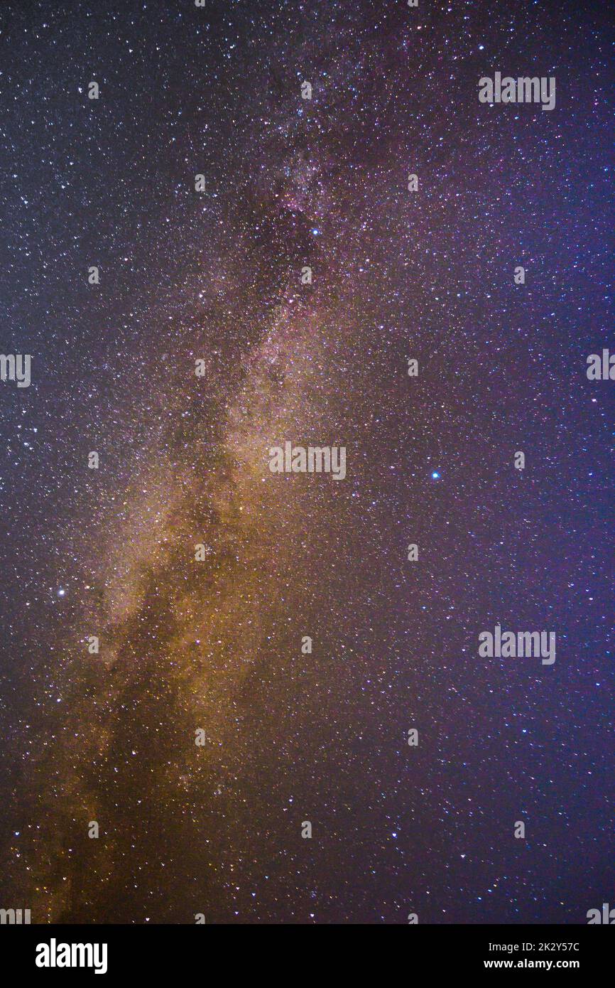 A vertical background of milky way on a starry night sky Stock Photo ...