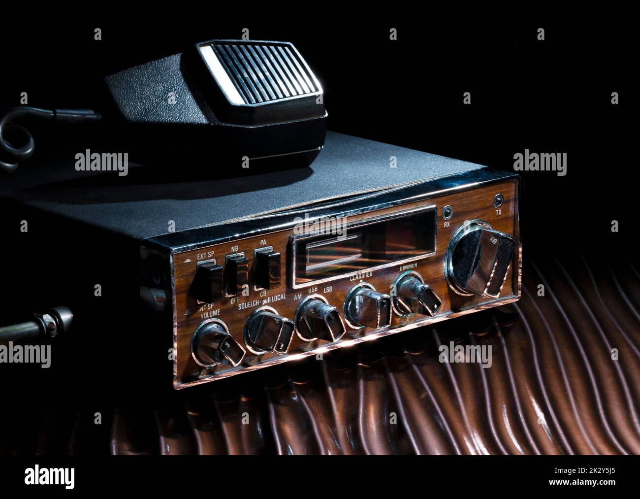 Sideband CB radio with mike on a wavy bronze surface Stock Photo - Alamy