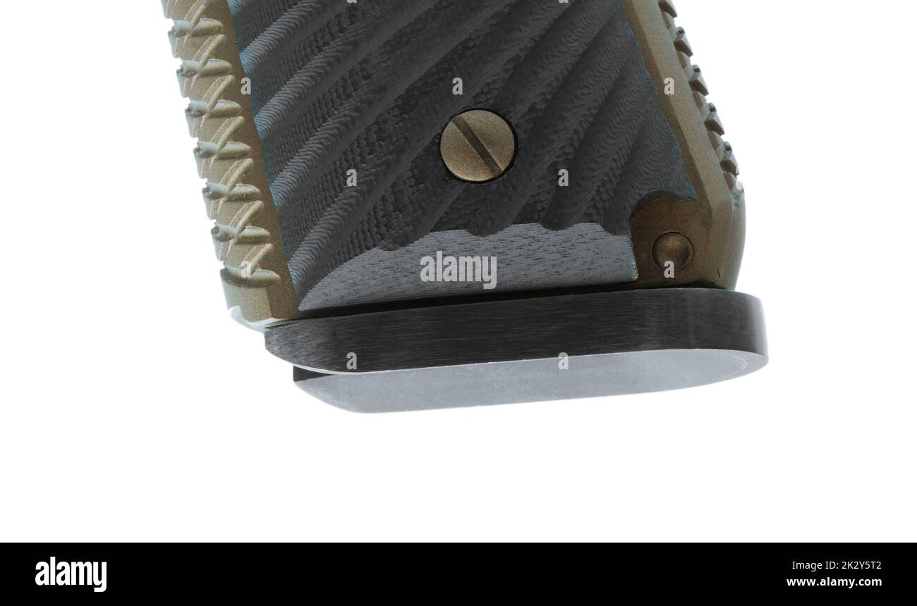 Beveled magazine well installed on a semi-auto handgun isolated on ...