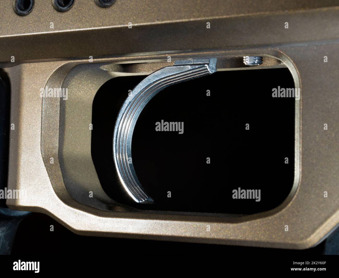 Black rifle trigger on a metallic copper colored rifle Stock Photo - Alamy