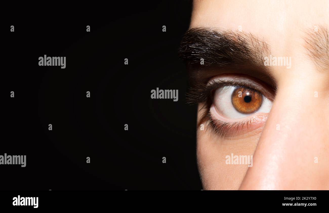 Image of man's brown eye close up. Insightful look Stock Photo - Alamy