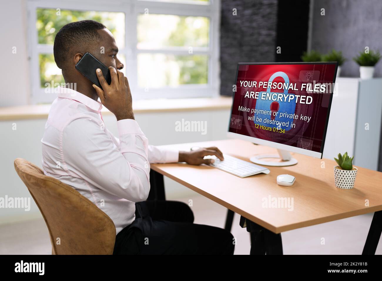 Ransomware Malware Cyber Attack On Business Computer Stock Photo - Alamy