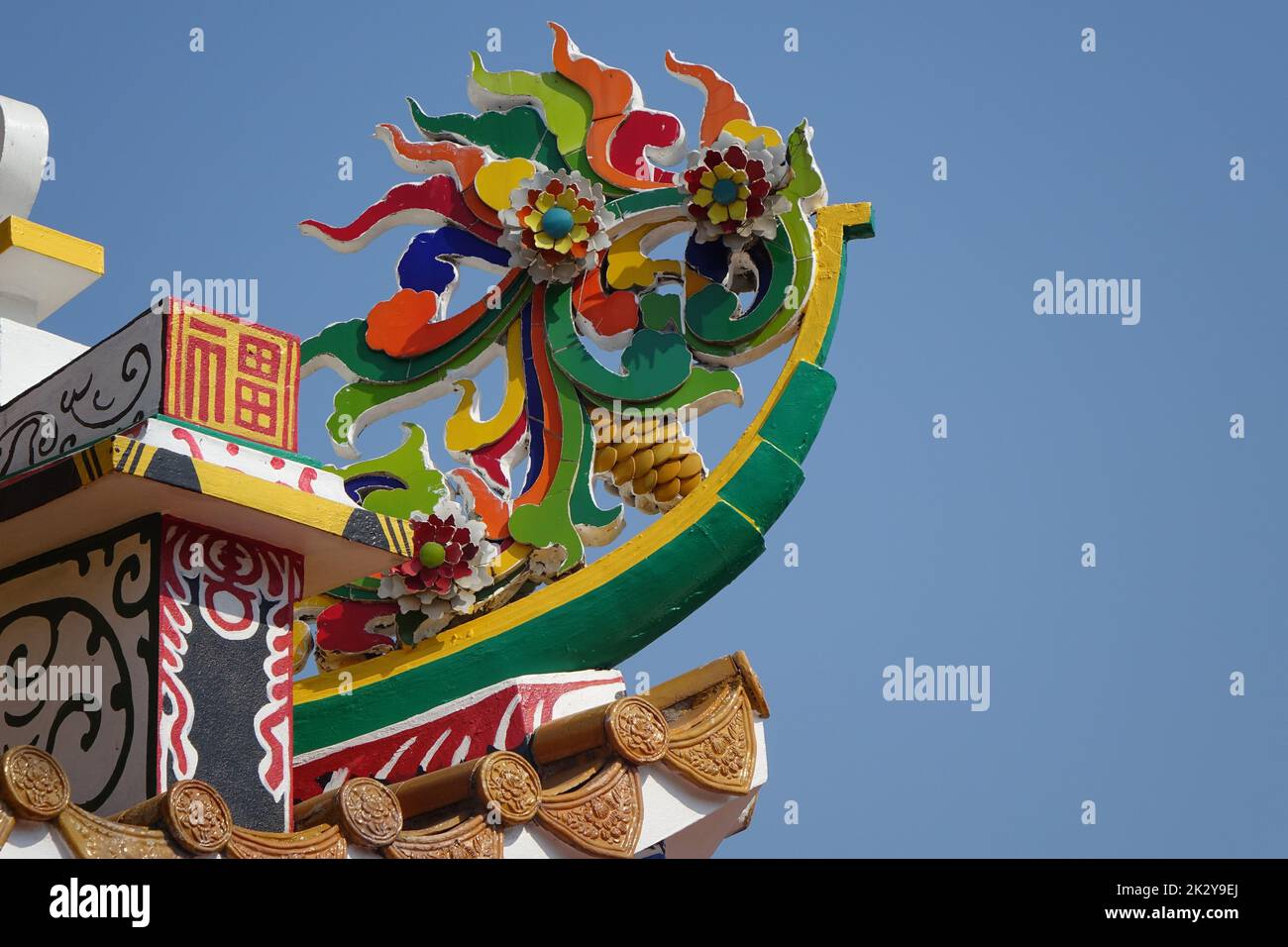 A low angle shot of a decorative colorful dragon sculpture in Tha ...