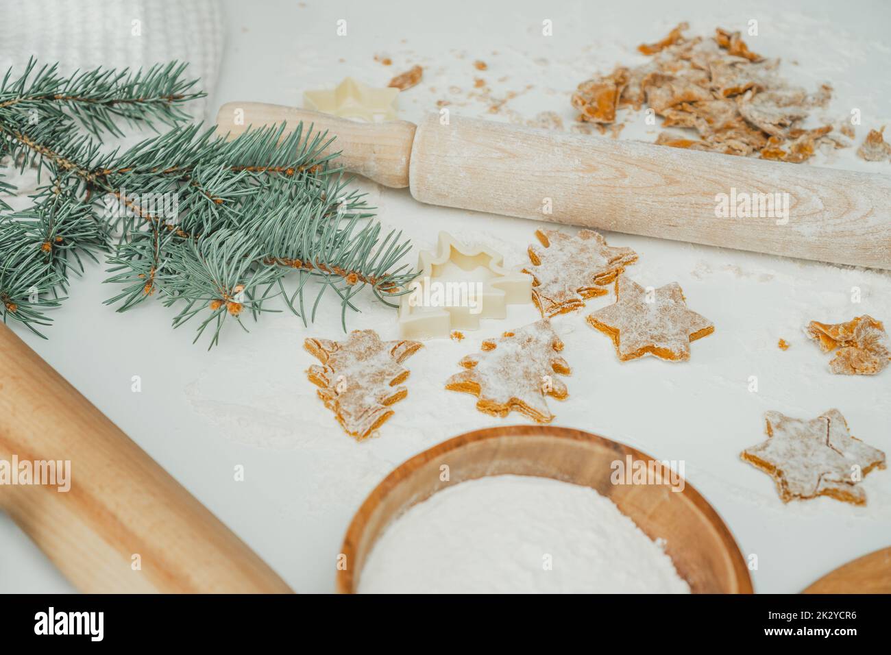 Partially blurred raw gingerbread cookies in shape of christmas trees ...