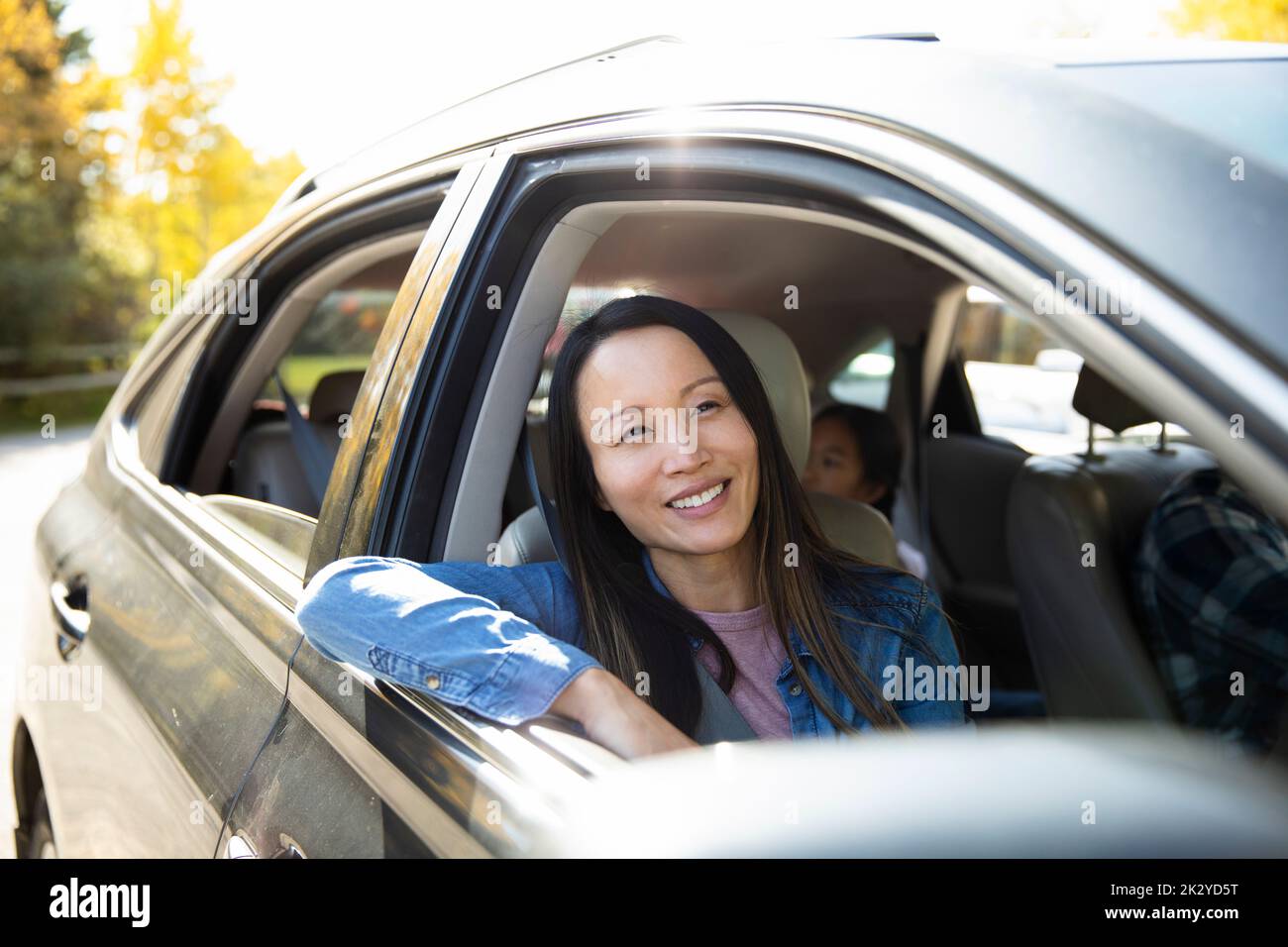 Family riding in car together hi-res stock photography and images - Alamy