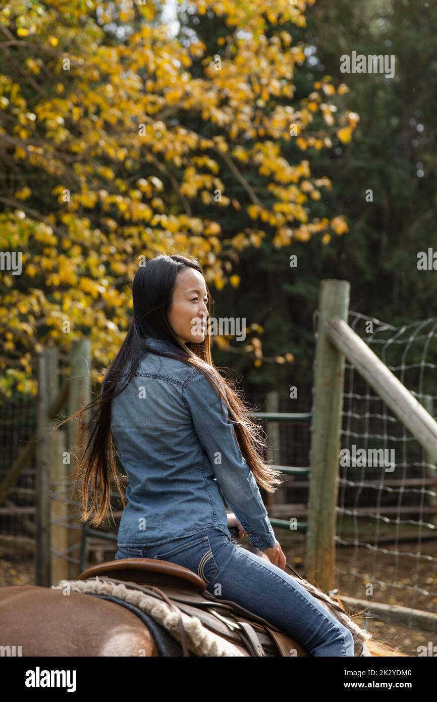 Beautiful woman riding black horse hi-res stock photography and images ...