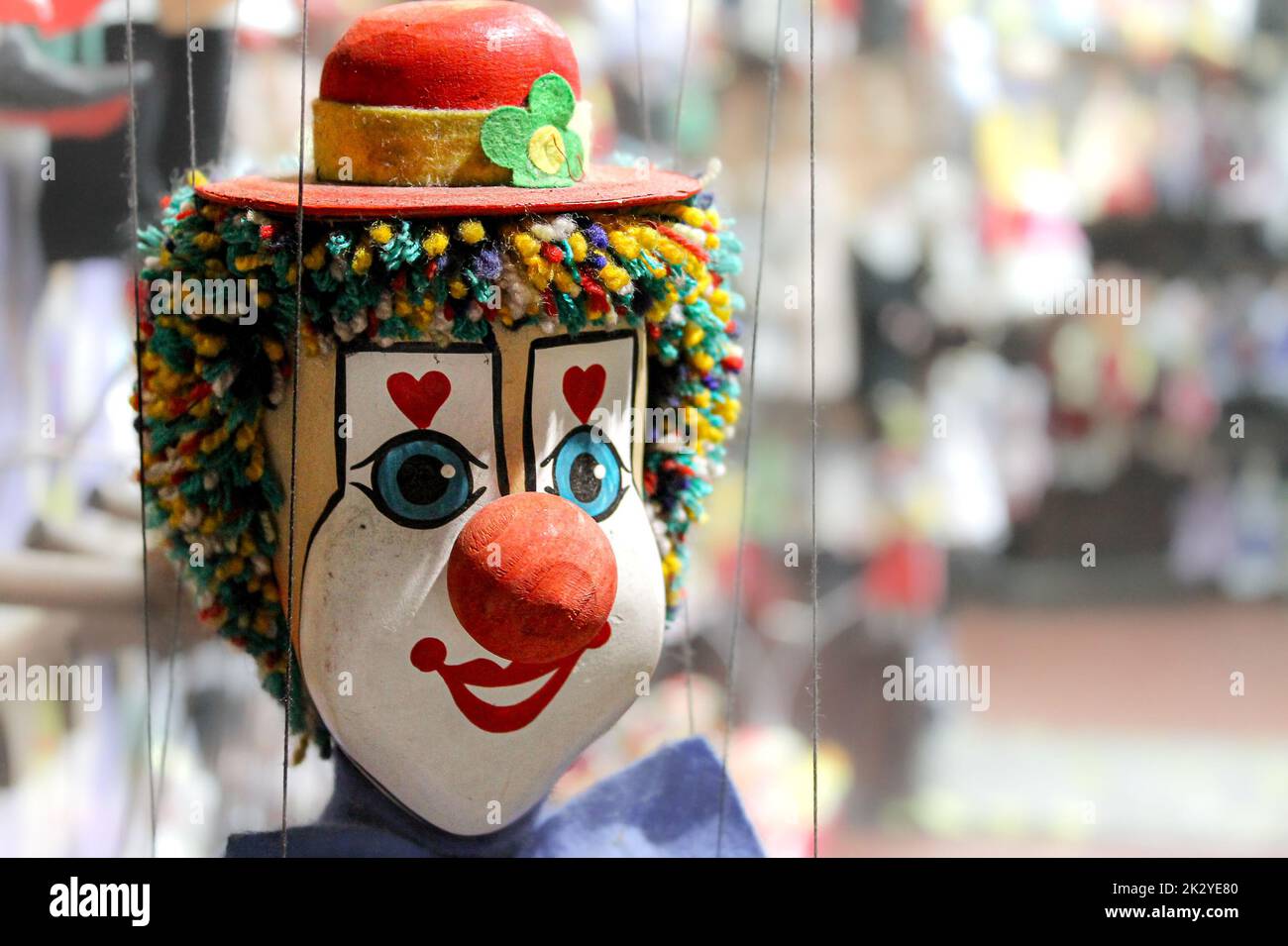 clown puppet hanging in a street Stock Photo - Alamy