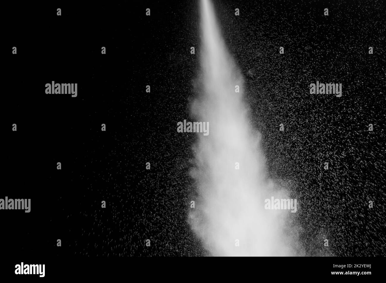 Curly white steam rising up and splashing water scattering in different ...