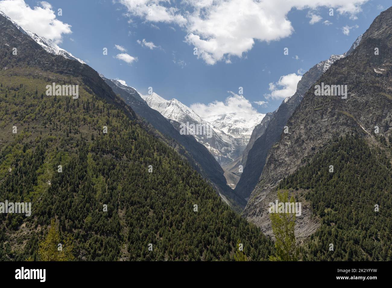 A scenery of high hills against a blue sky Stock Photo - Alamy