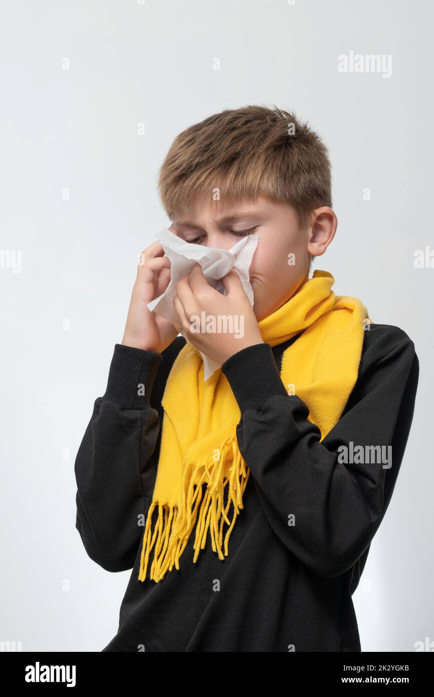 A child blows his nose into a napkin, children's seasonal diseases, a ...
