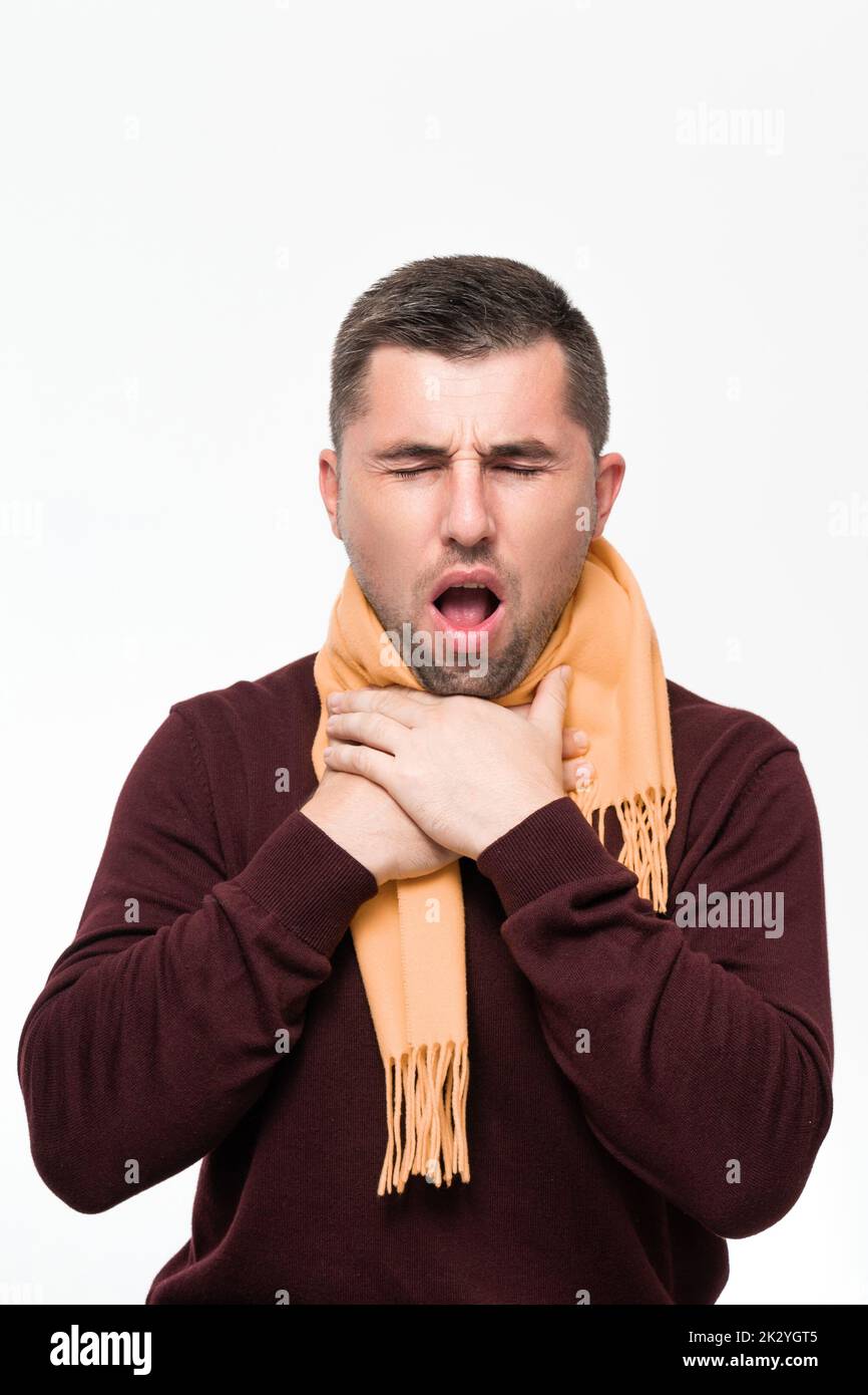 A man suffers from a sore throat, a man wrapped his throat with a scarf ...